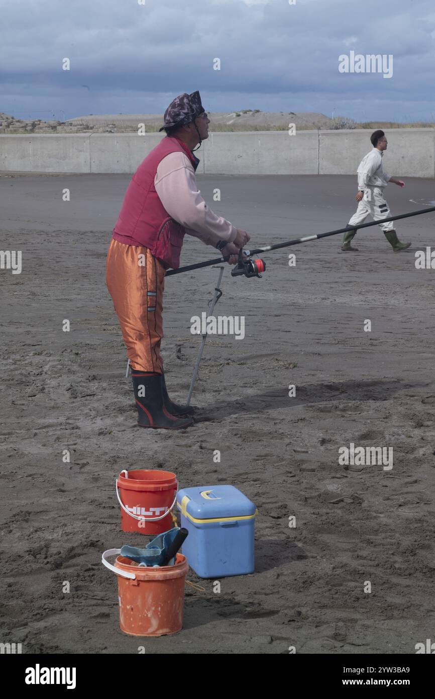 Fisherman on the beach, Shari port Breakwater, Hokkaido, Japan, Asia ...