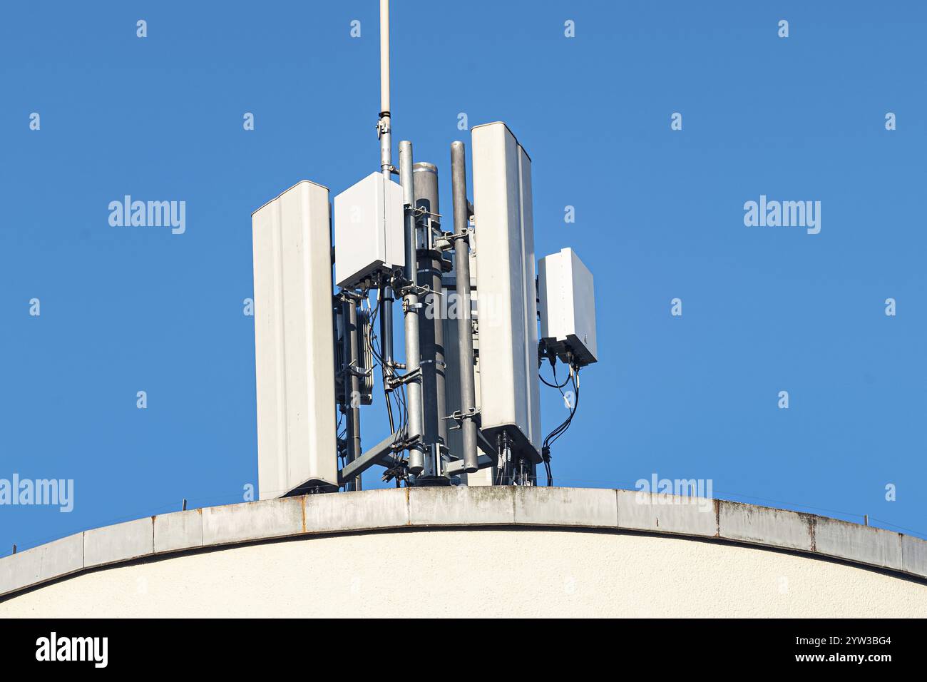 Tower with antennas on a roof of a building Stock Photo - Alamy