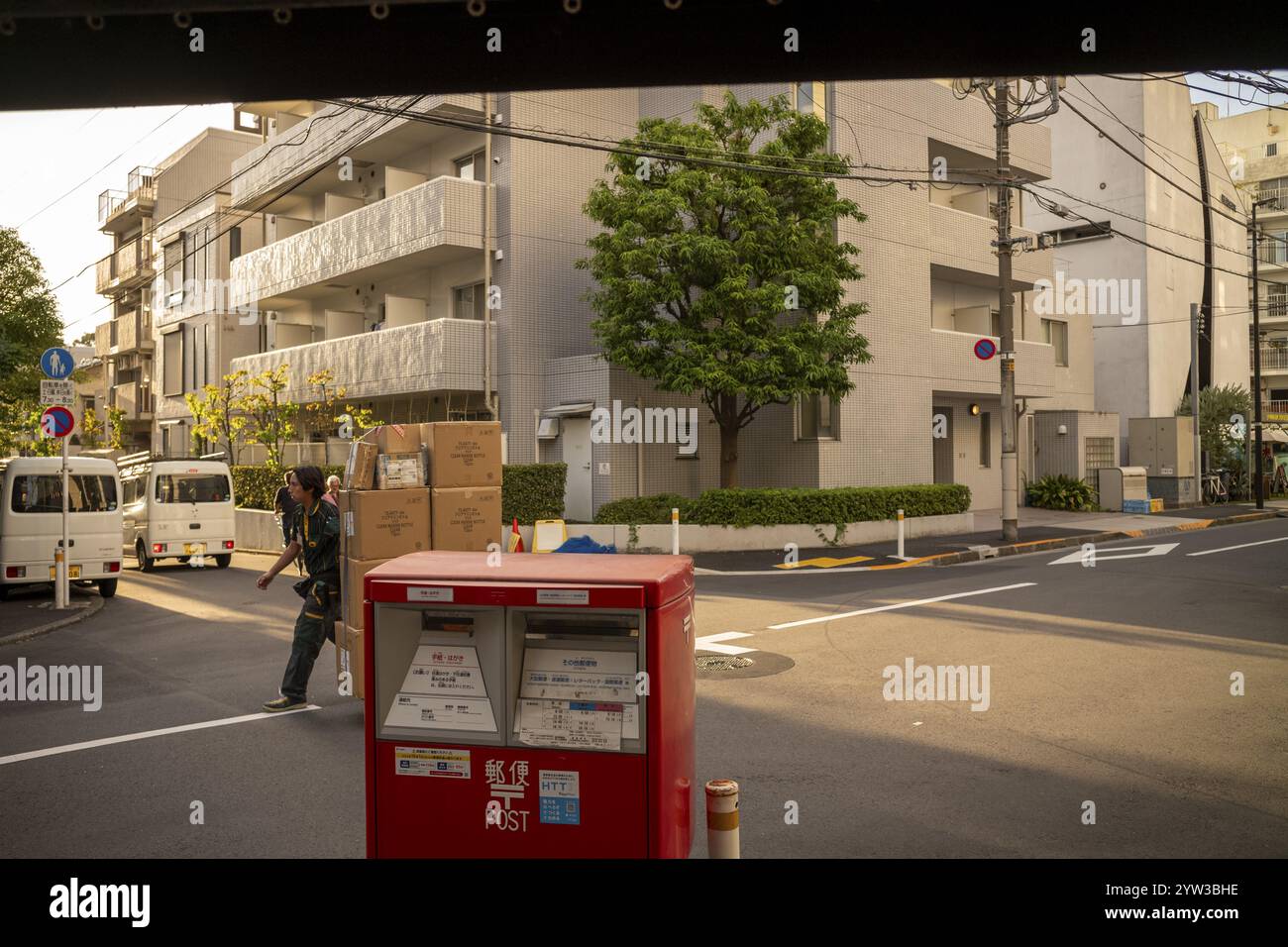 Man carrying parcels, red mailbox, Shibuya, Tokyo, Japan, Asia Stock ...