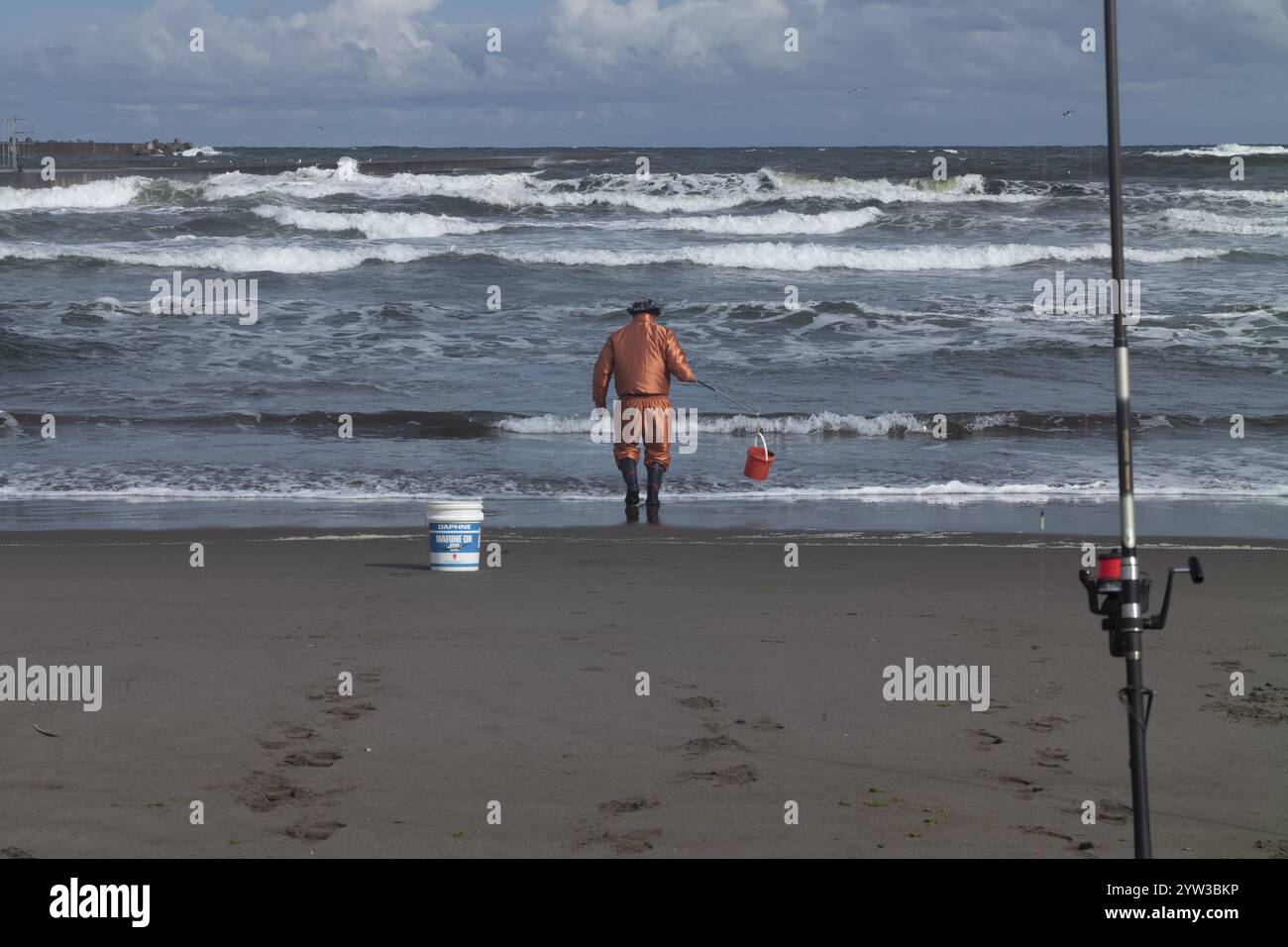 Fisherman on the beach and fishing rod, Shari port Breakwater, Hokkaido ...
