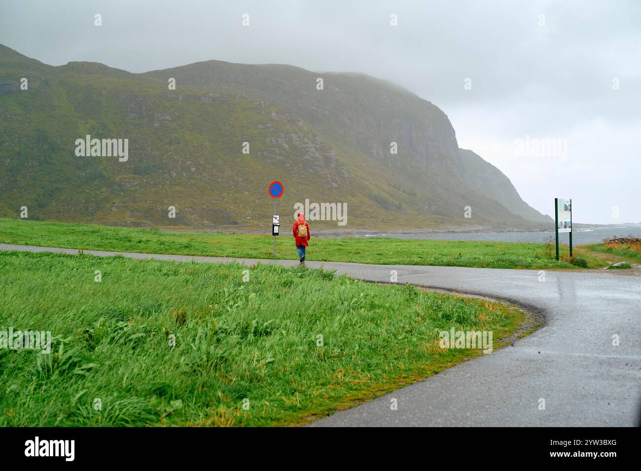 Person in red jacket hi-res stock photography and images - Alamy