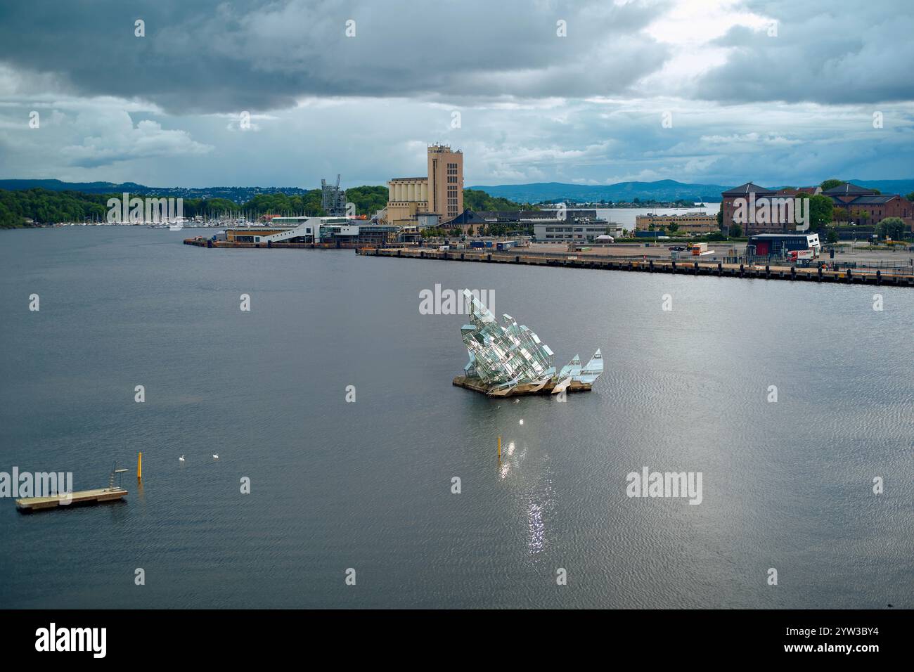 Aerial view of a harbor with a unique glass sculpture floating in the ...