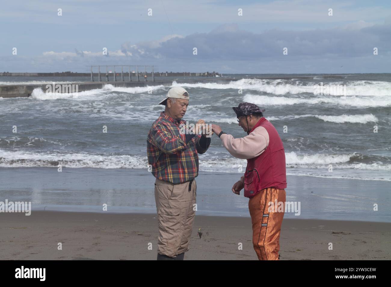 Fisherman on the beach, Shari port Breakwater, Hokkaido, Japan, Asia ...