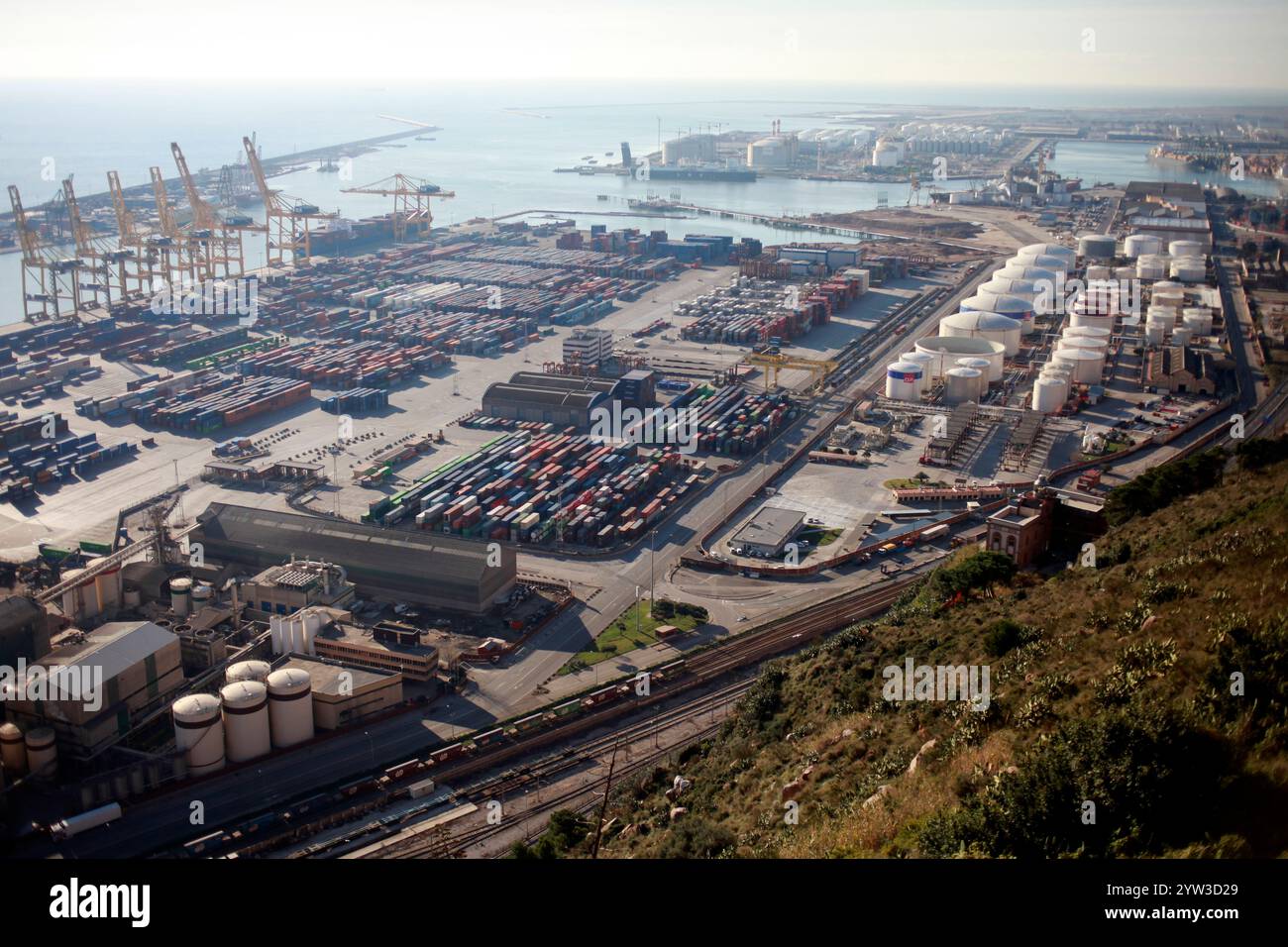 Aerial view of a bustling commercial port with cargo containers, cranes ...