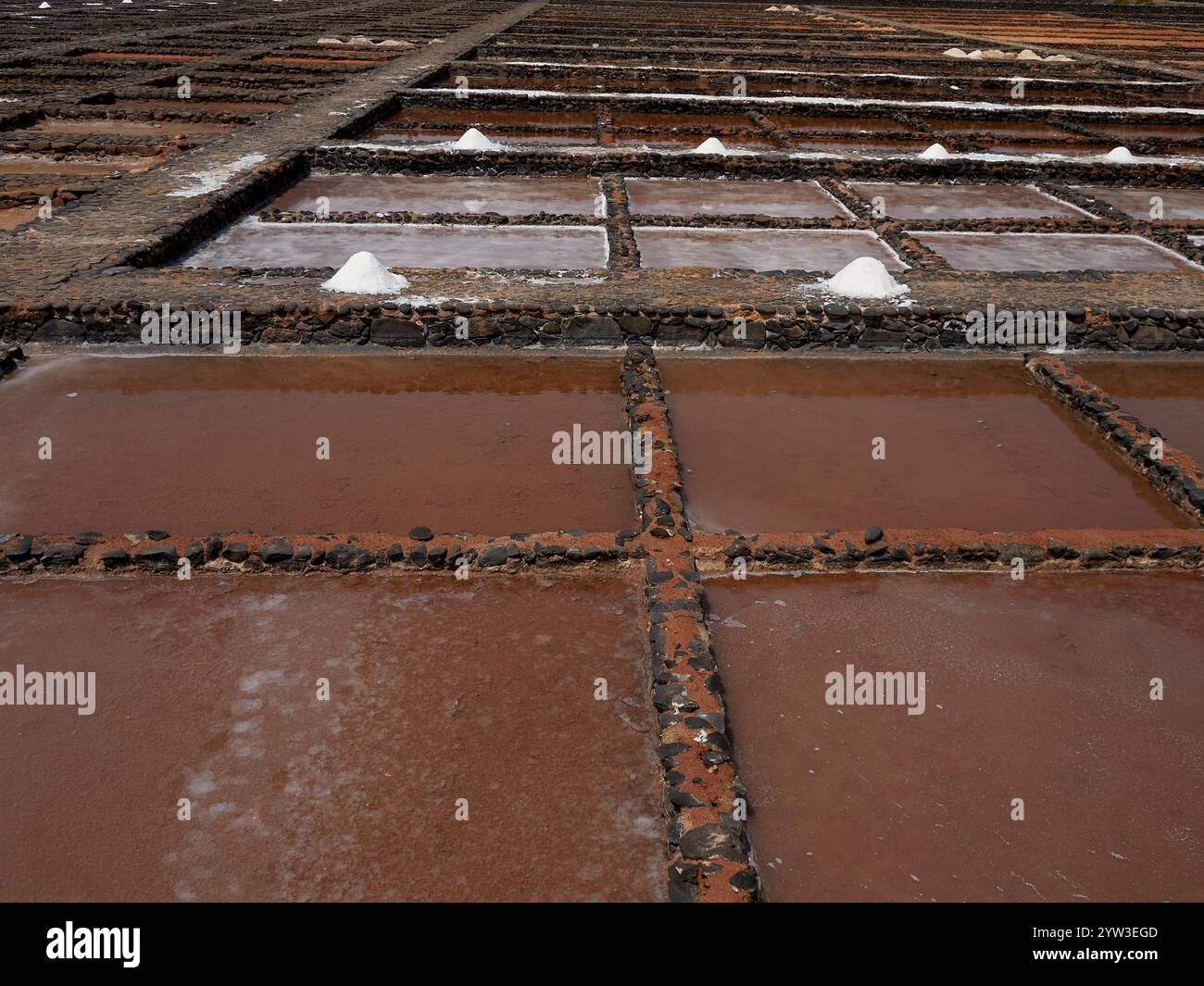Aerial view of salt evaporation ponds with distinct rectangular ...