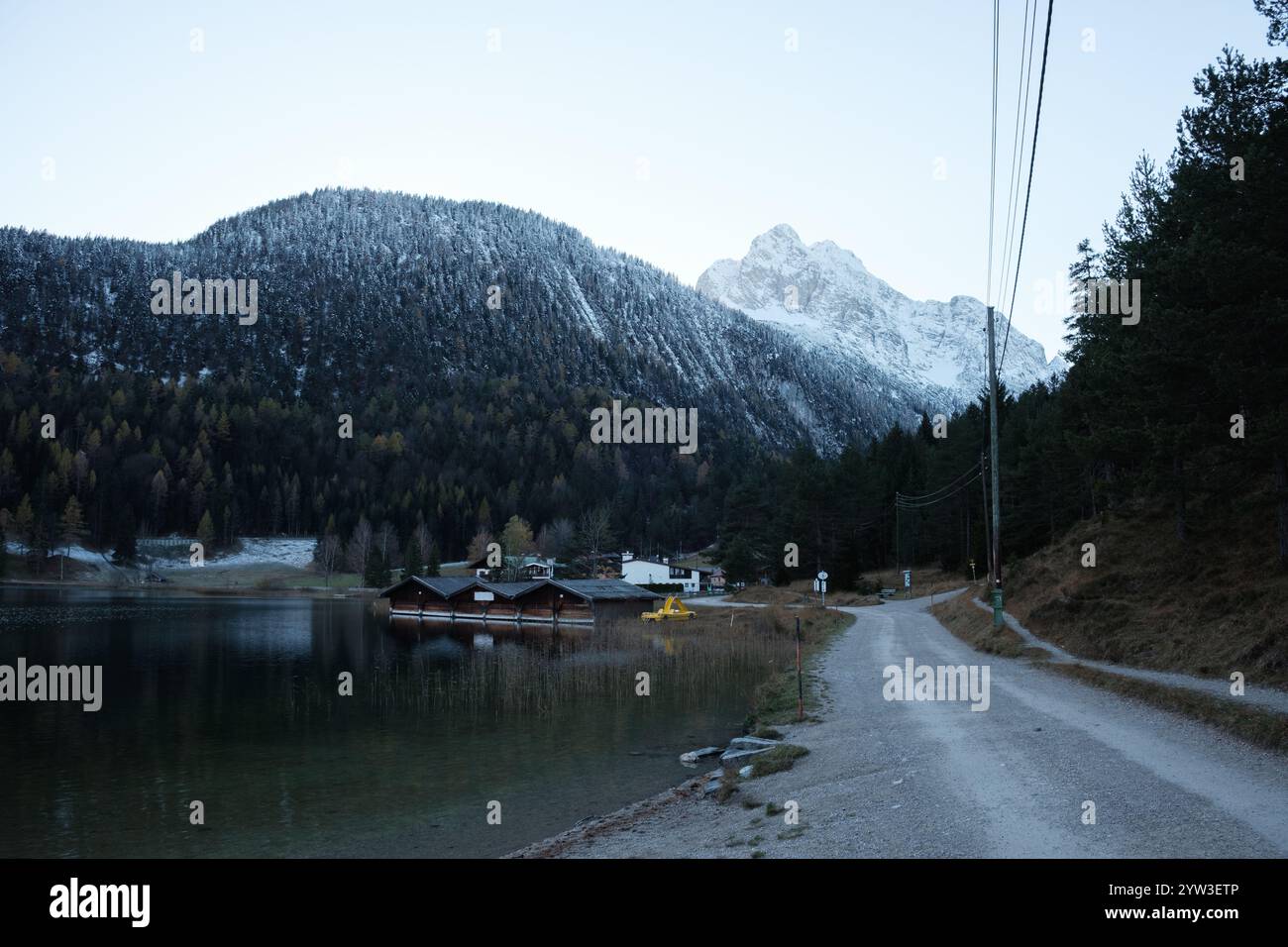 Snow-covered mountains and a tranquil lake define this winter scene in ...