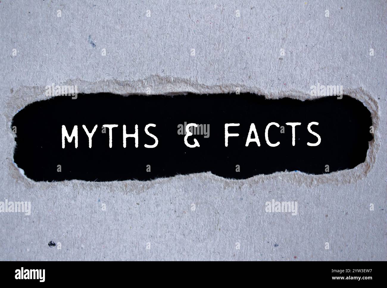 Myths and facts message written on ripped torn gray paper with black ...