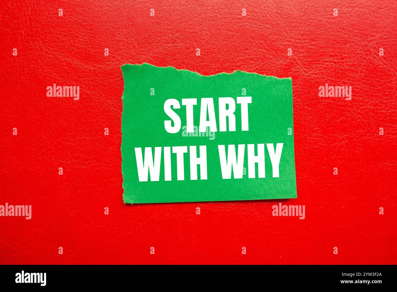 Start with why message written on ripped torn green paper piece with red background. Conceptual ...