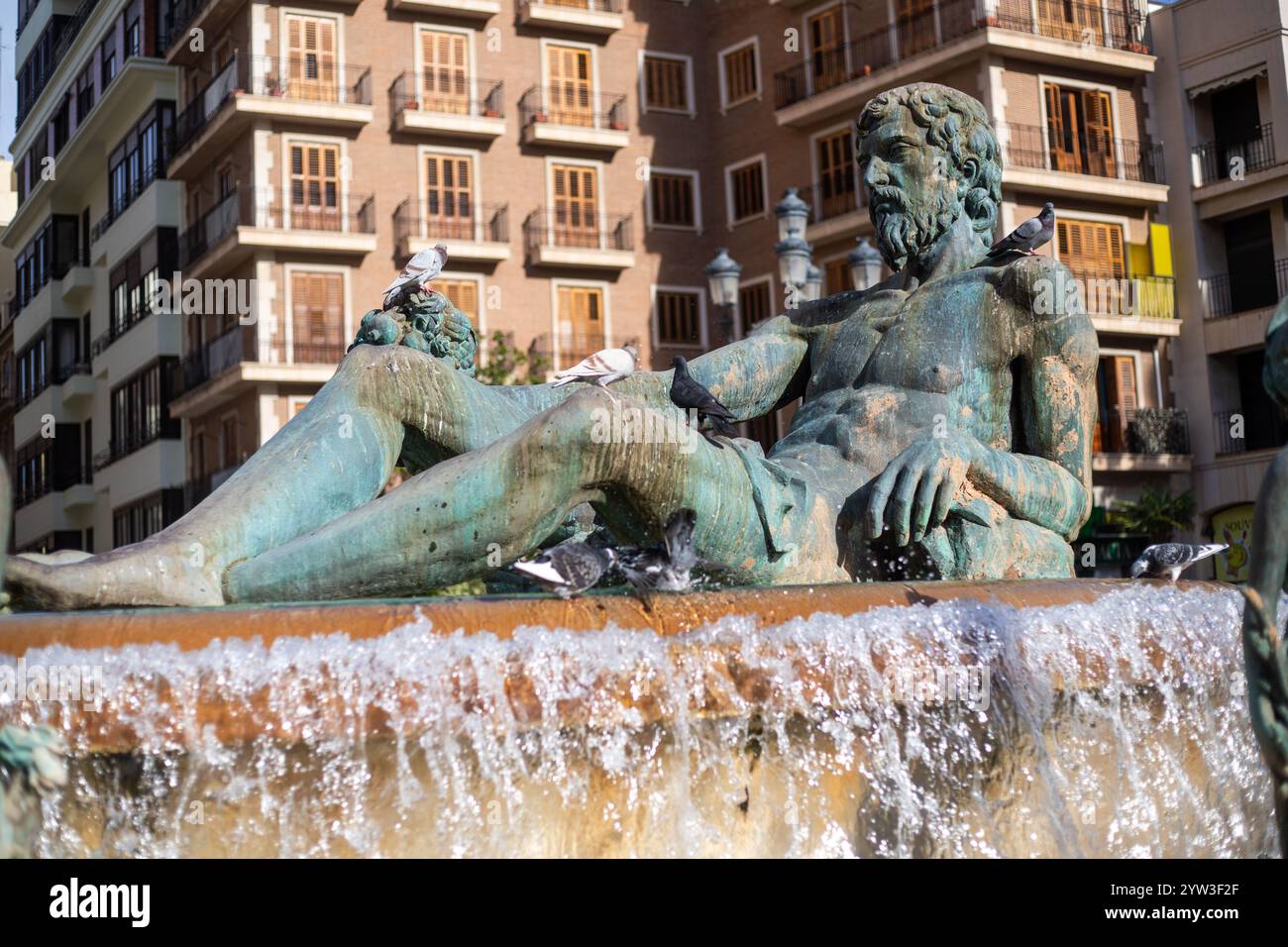 The fountain in the Plaza de la Virgen in Valencia is called Turia ...