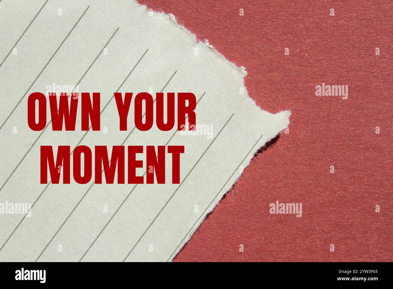 Own your moment message written on ripped torn lined paper with red ...