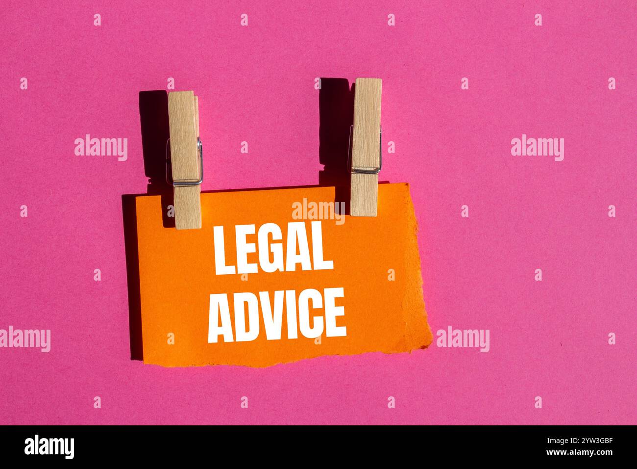 Legal advice message written on ripped torn orange paper piece with ...