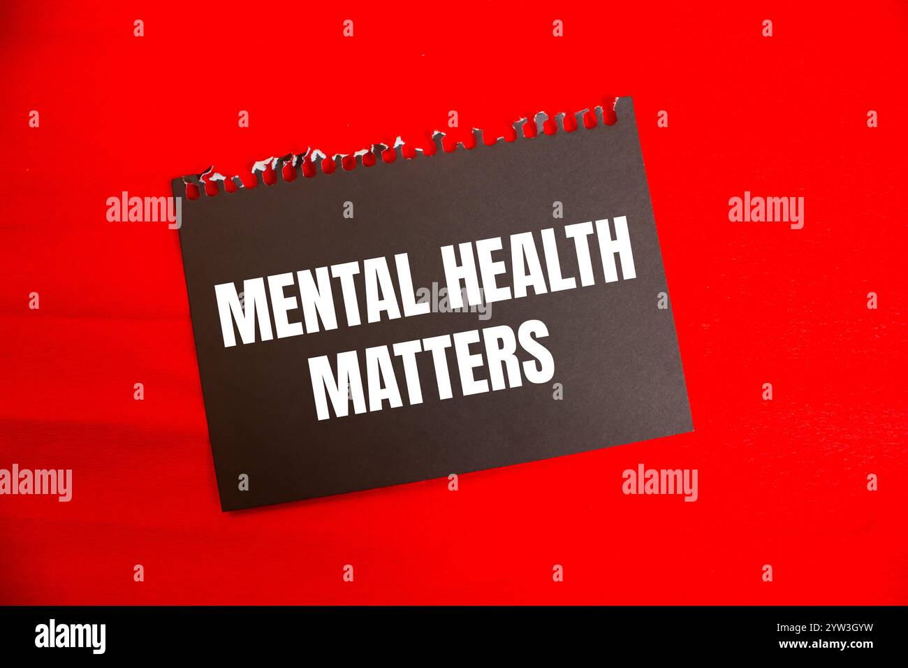 Mental health matters message written on black paper with red ...