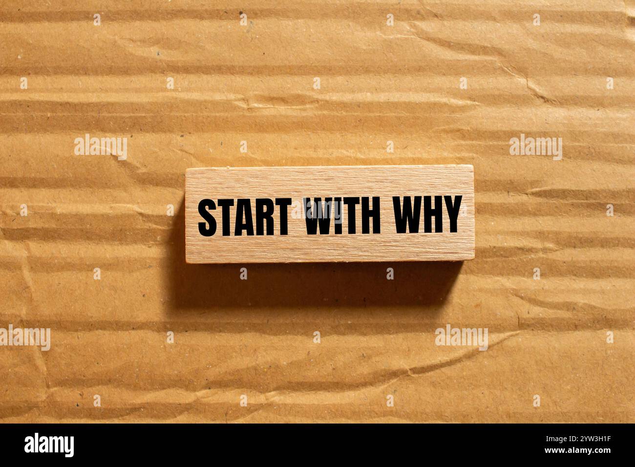 Start with why message written on wooden block with cardboard ...