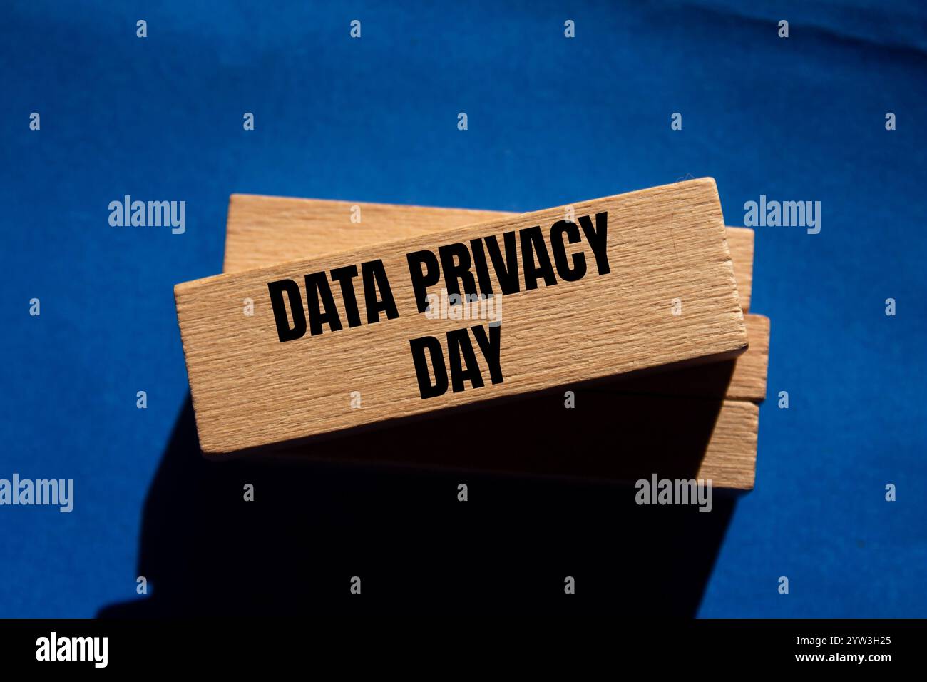 Data privacy day message written on wooden blocks with blue background ...
