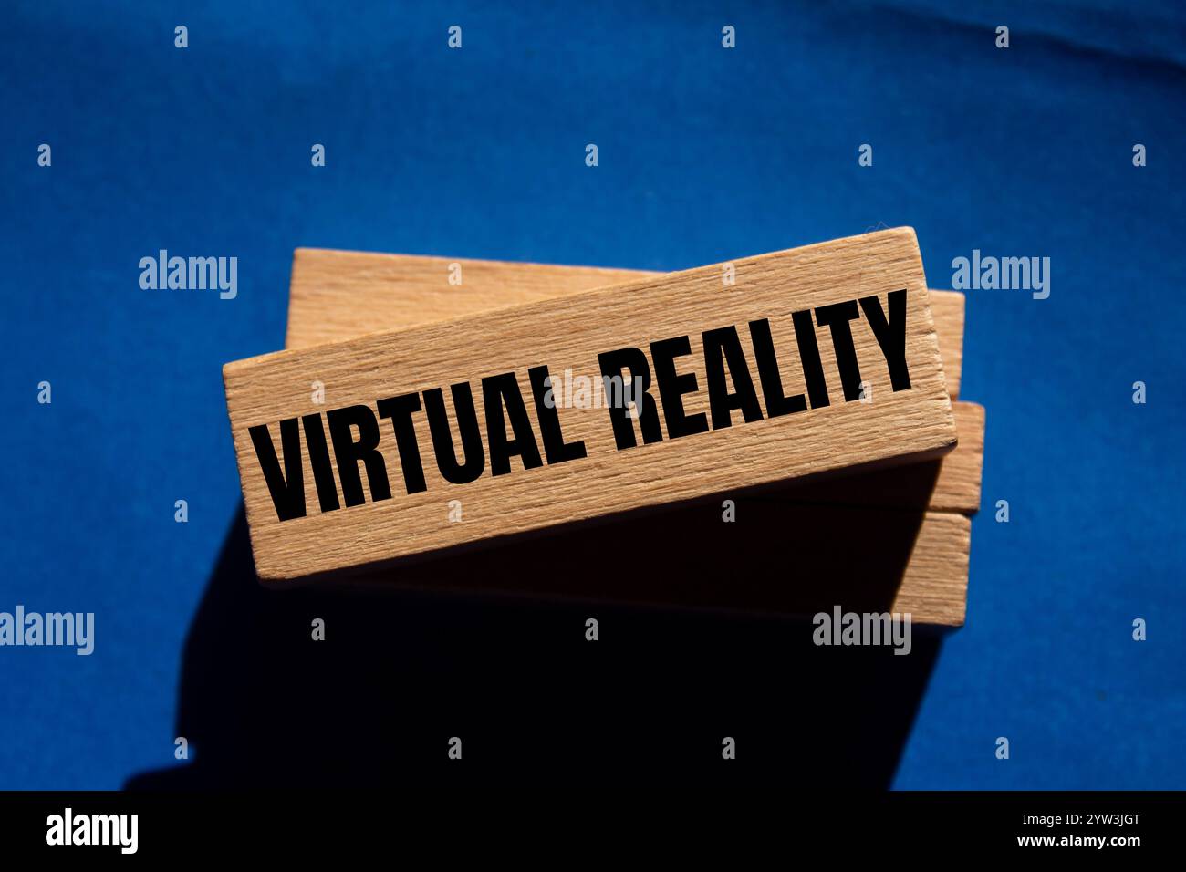 Virtual reality message written on wooden blocks with blue background ...