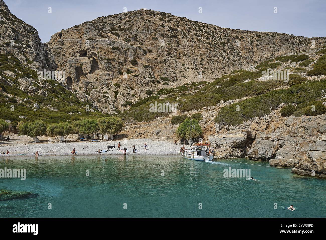 Palatia Beach, Palatia, A quiet bay surrounded by mountains, with a ...