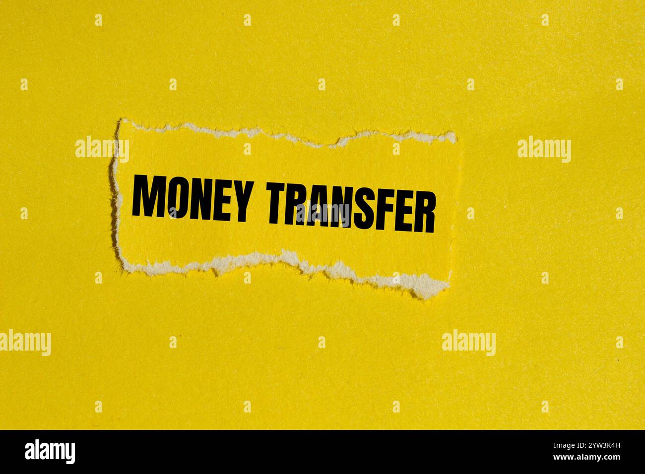 Money transfer message written on ripped yellow torn paper piece with ...