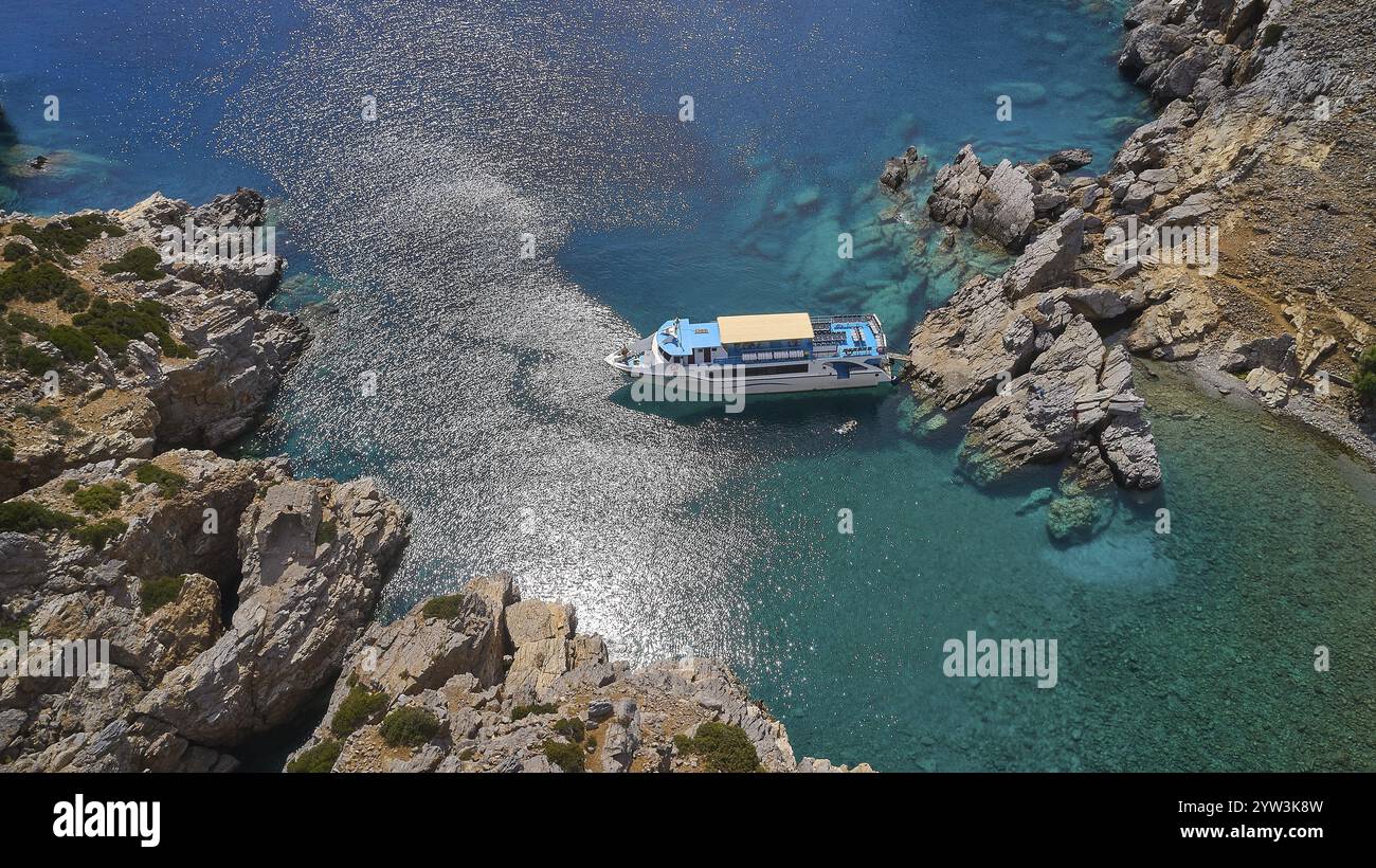 Palatia Beach, Palatia, A boat in a sun-drenched, turquoise-coloured ...