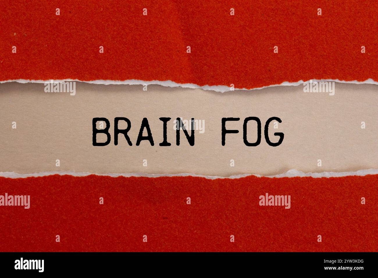Brain fog message written on ripped torn red paper with beige ...