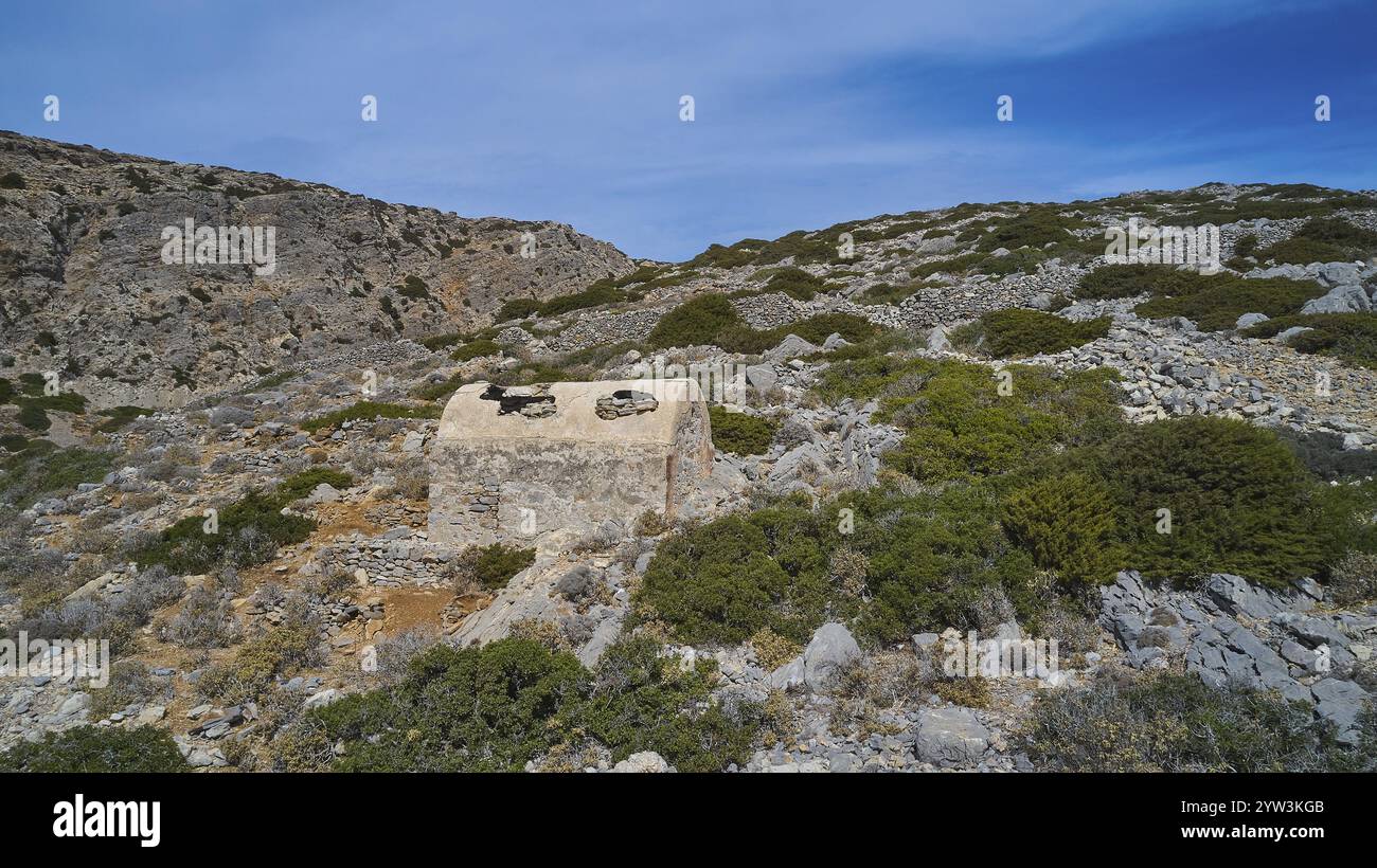 Palatia Beach, Palatia, stone hut between rocky hills with green ...