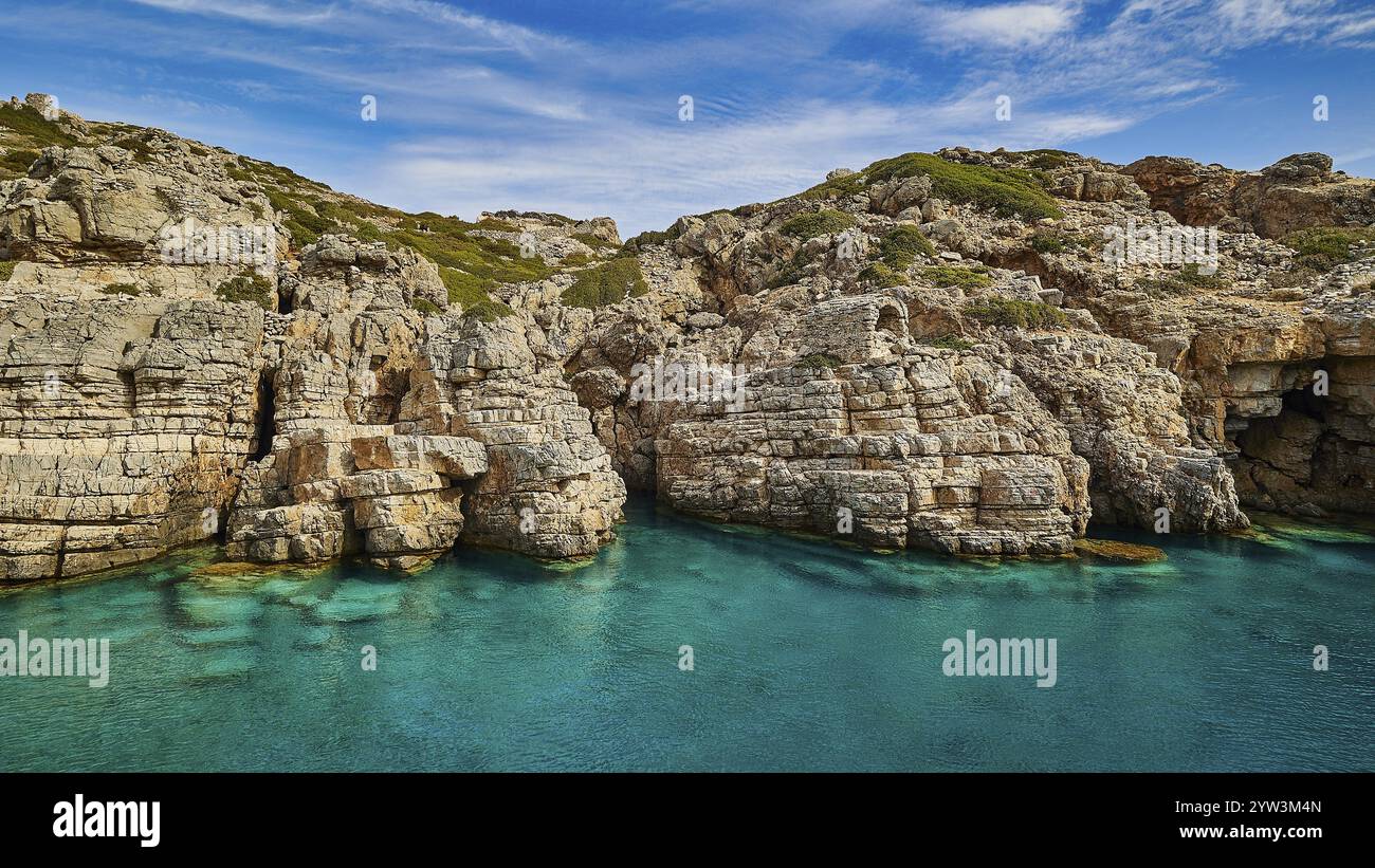 Palatia Beach, Palatia, Clear blue water surrounded by rocky cliffs ...