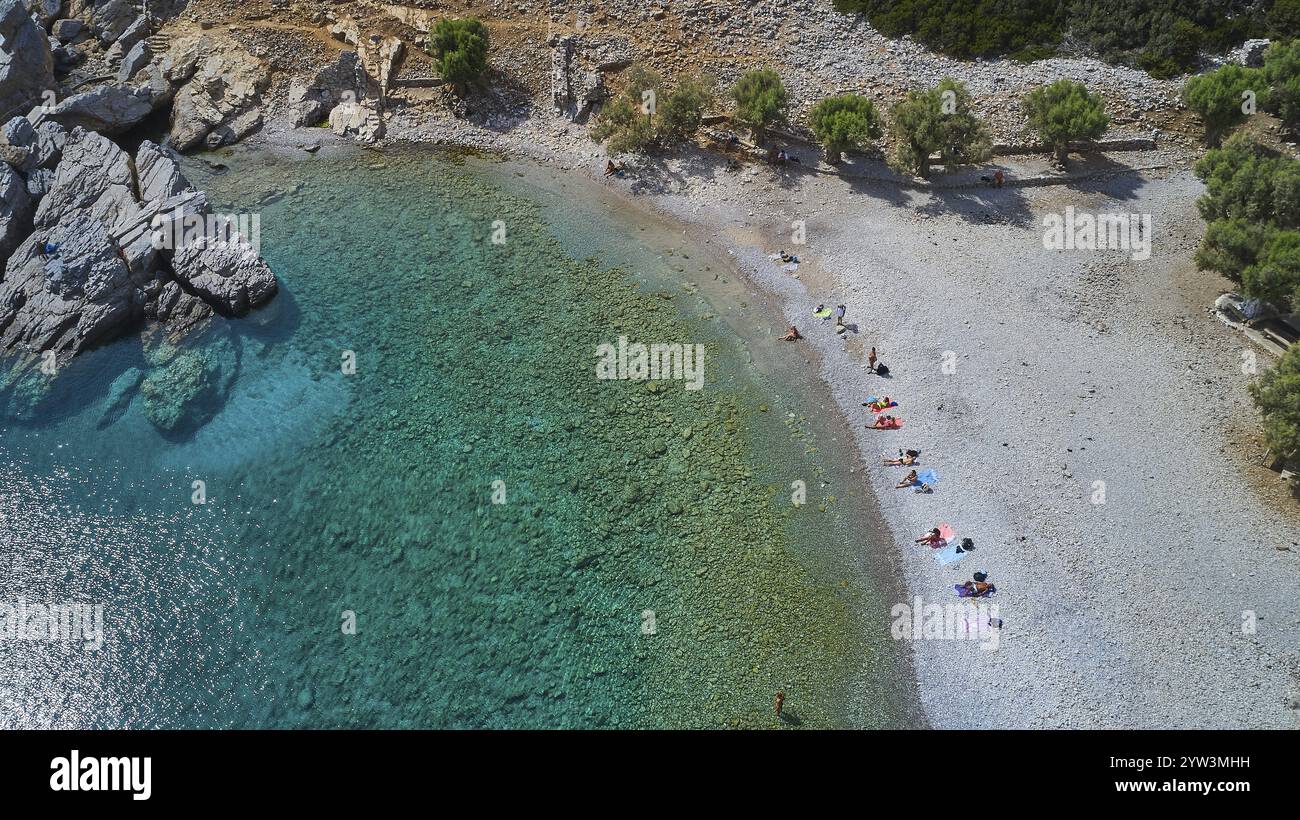 Palatia Beach, Palatia, people relaxing on a small, quiet beach with ...