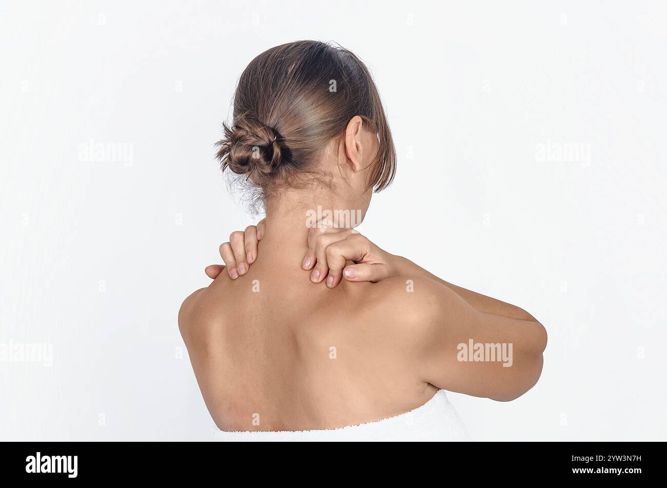 Neck pain, woman in towel, isolated on white background, studio shot ...