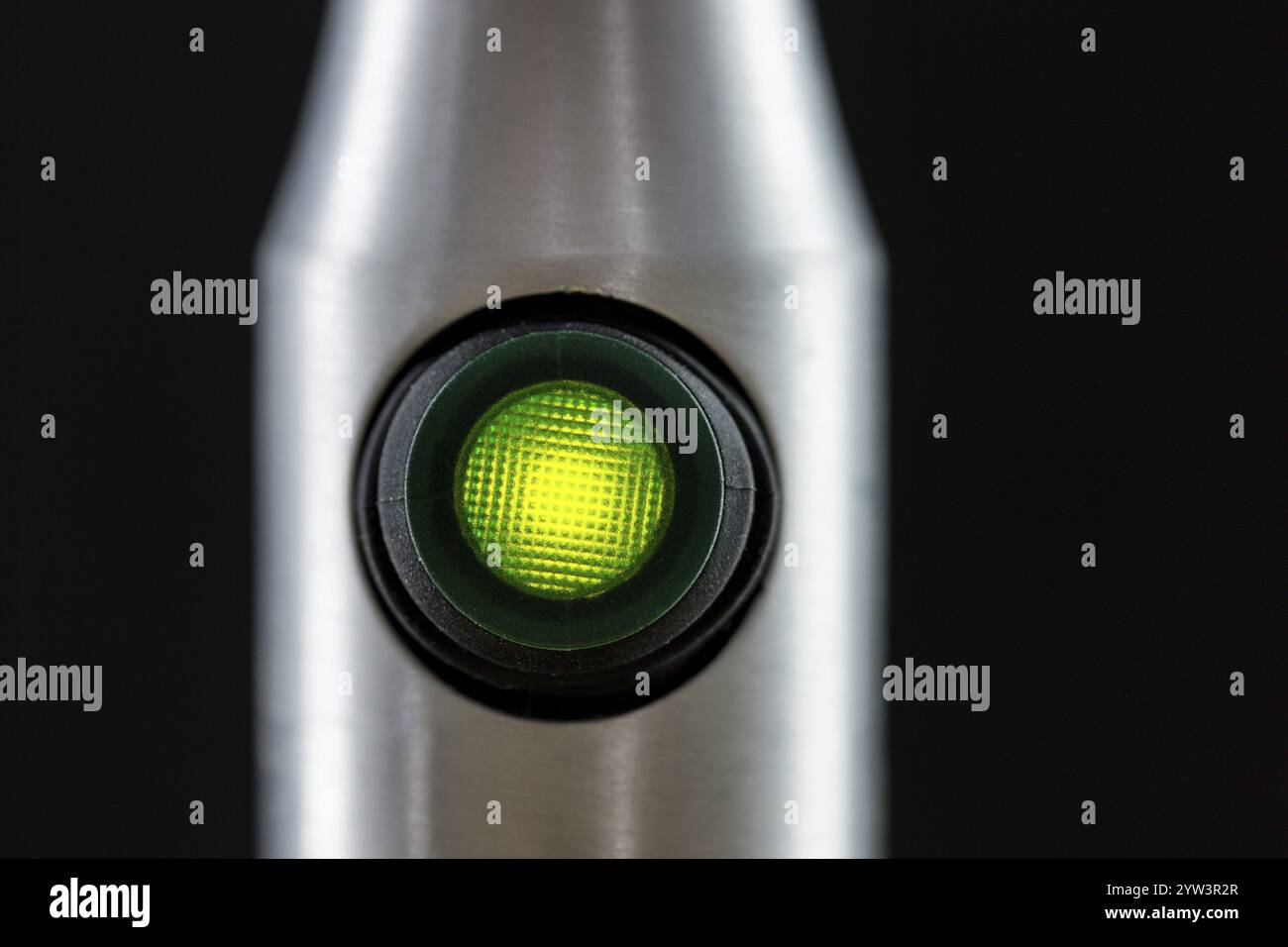 Green illuminated light switch on a lamp Stock Photo - Alamy