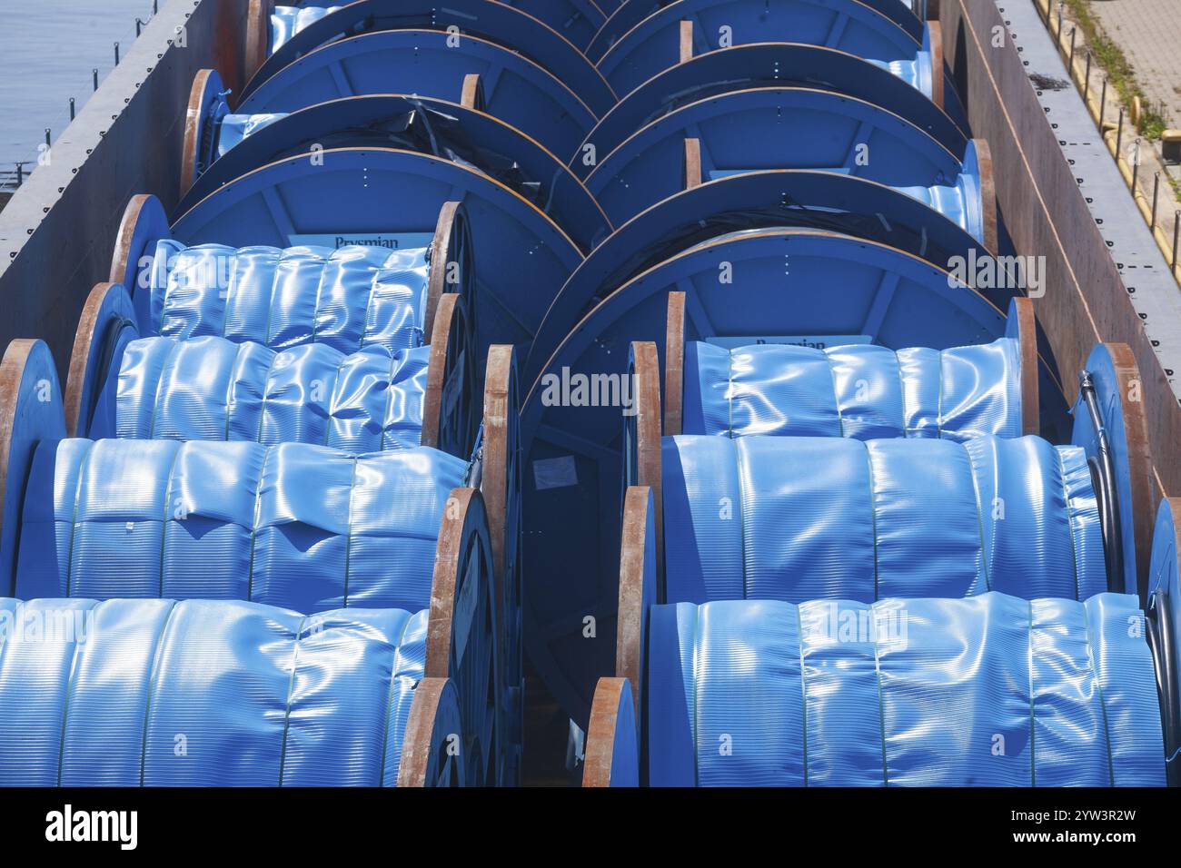 Inland waterway vessel with cargo of blue cable barrels, Hoya, Lower ...