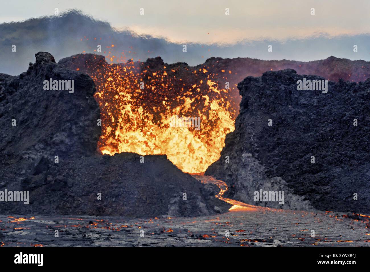 Heat flickering over the open cone of a volcano with lava, Grindavik ...