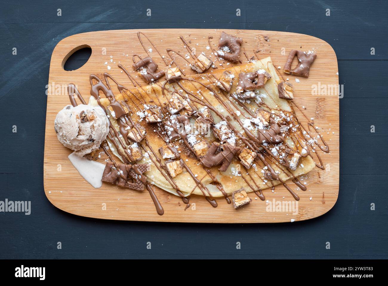 Delicious chocolate crepe served with chunks of curly wurly and ...