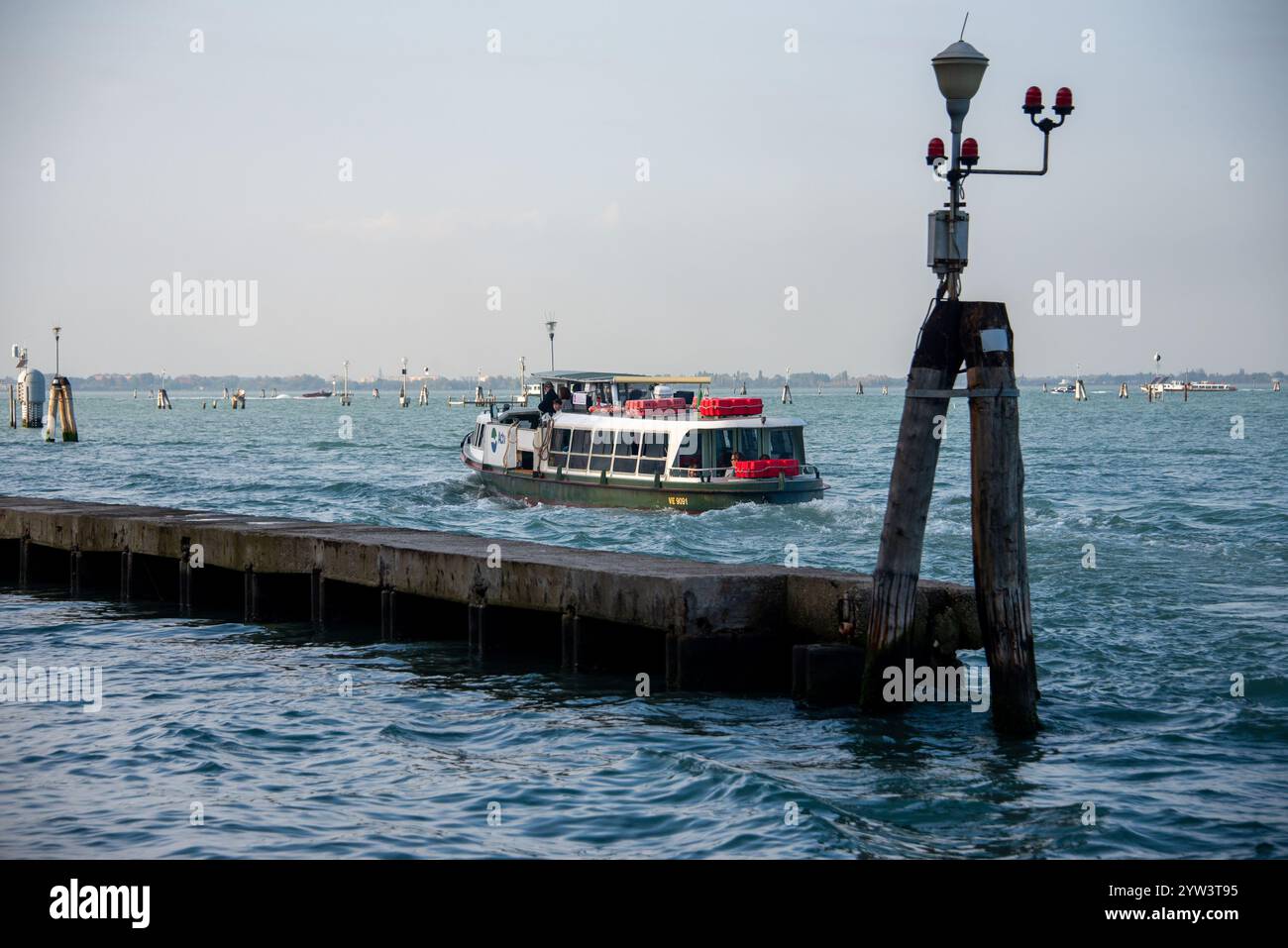 A typical vaporetto ferry boat crossing the lagoon around the North ...