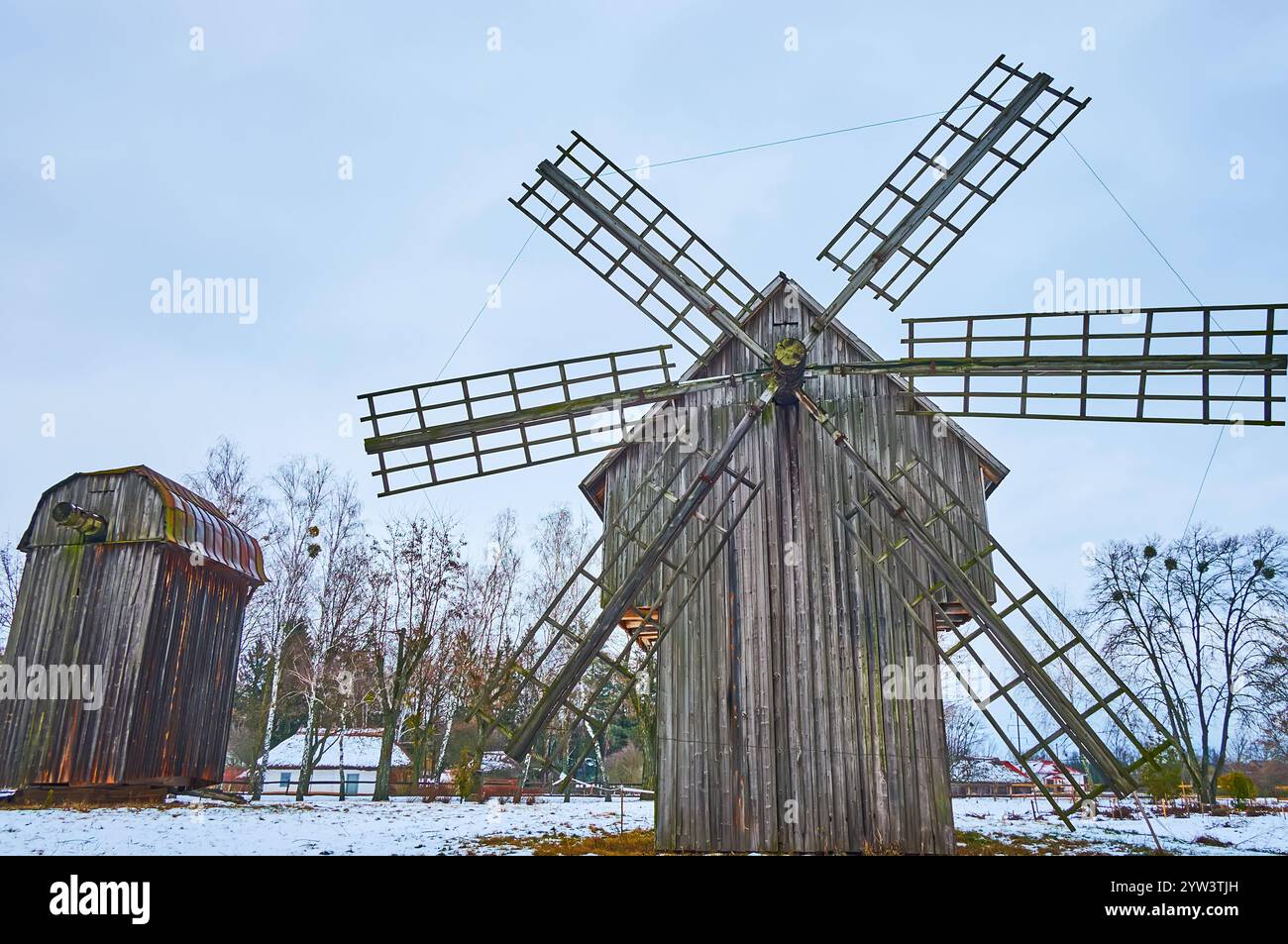 Panoramic view of the medieval wooden windmill with big sails ...