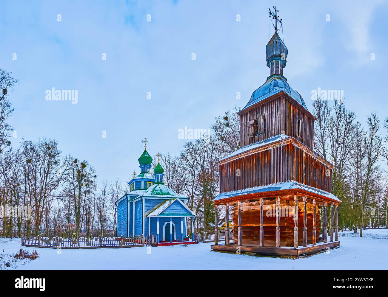 The medieval wooden belfry and Intercession Church, located in ...