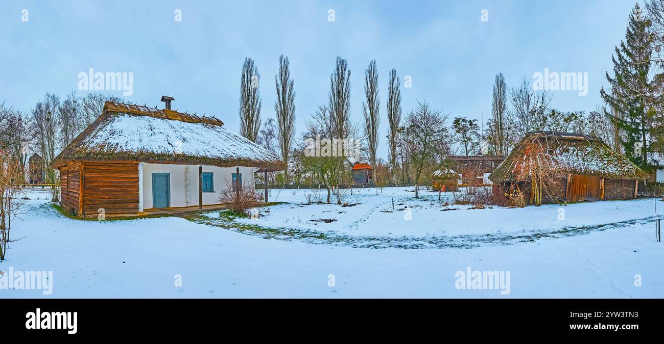 Winter panorama of vintage farmstead with adobe and wooden houses ...