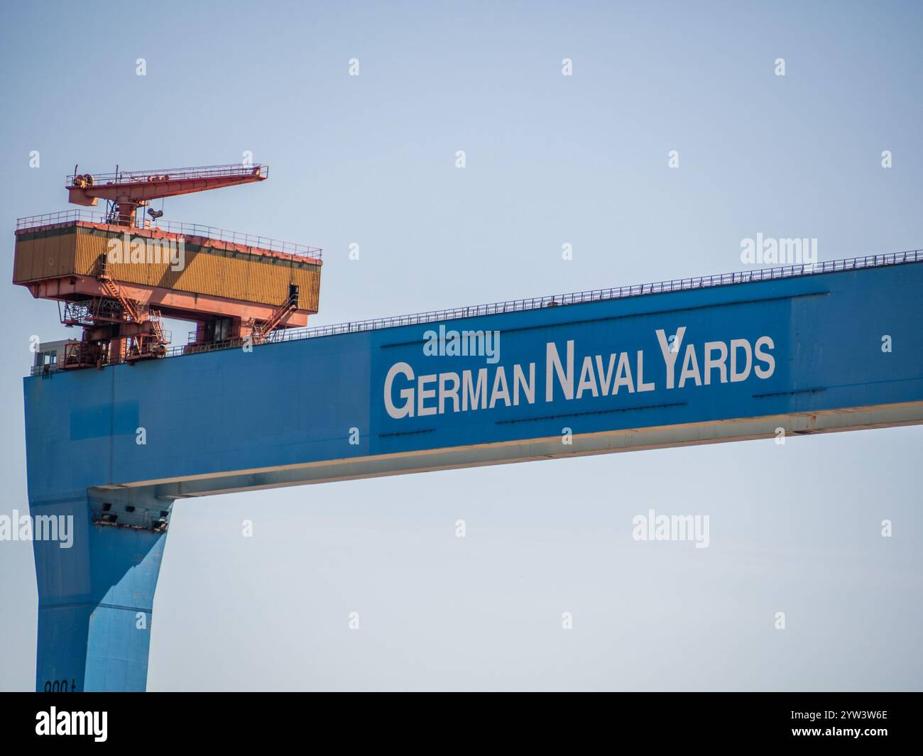 Looking up to the huge gantry crane of German Naval Yards against a ...