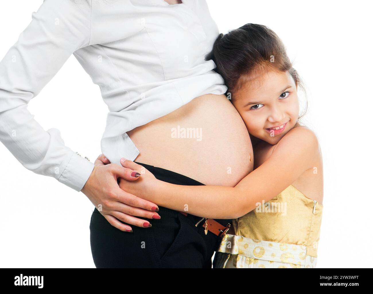 cute little girl hugging belly pregnant mom Stock Photo - Alamy