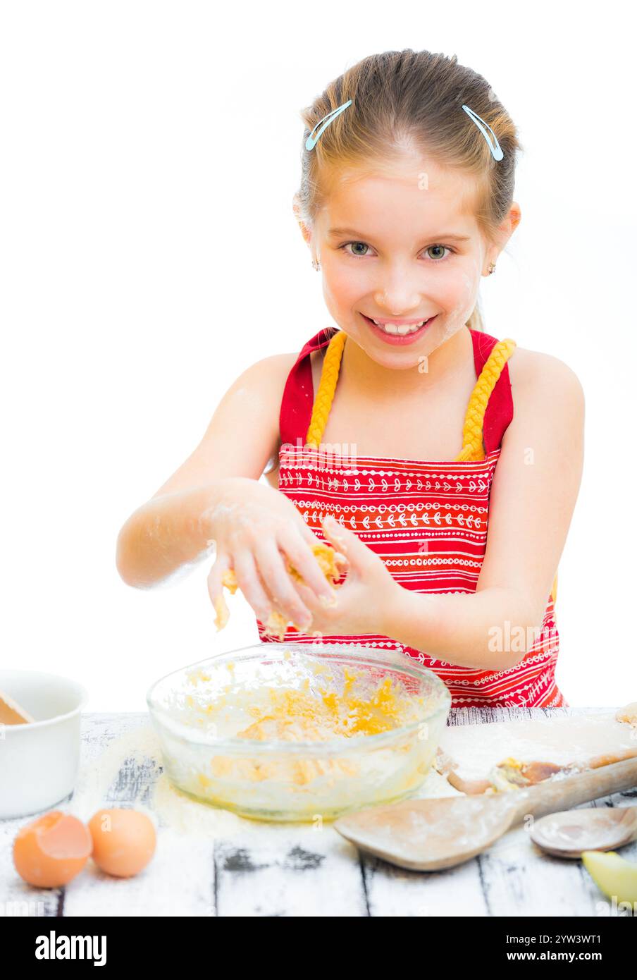 cutre little girl making dough, on a white background Stock Photo - Alamy