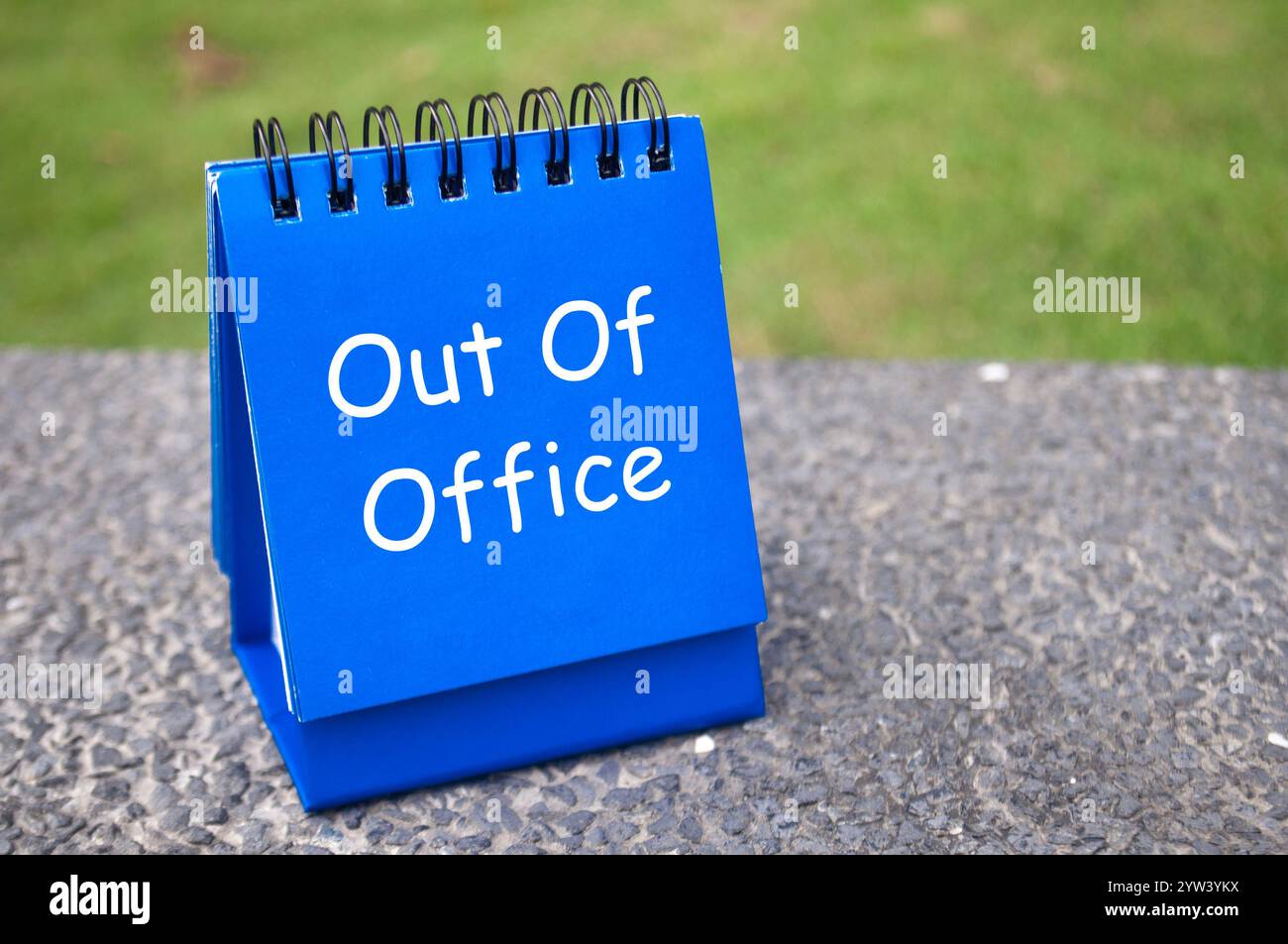 Side view of Out Of Office text on blue notepad. Off work concept Stock ...