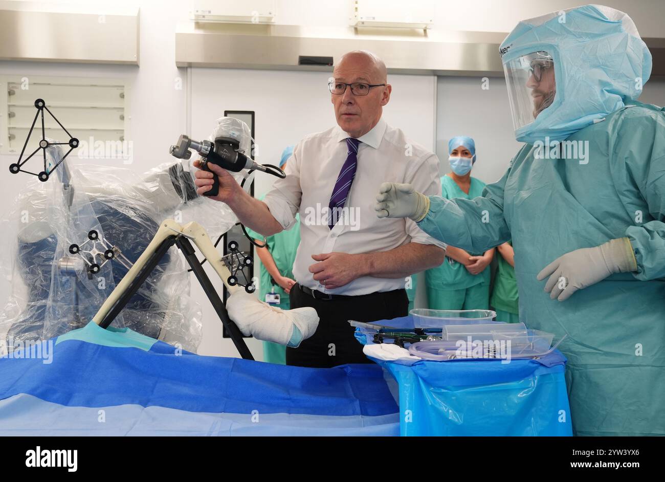 First Minister John Swinney alongside Chris Gee, Associate Medical ...