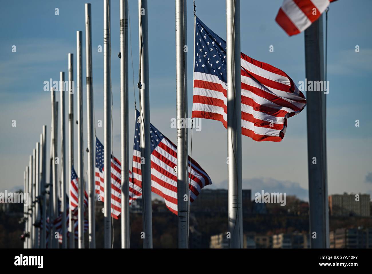 American flags are hung at half-staff to commemorate the 83rd ...