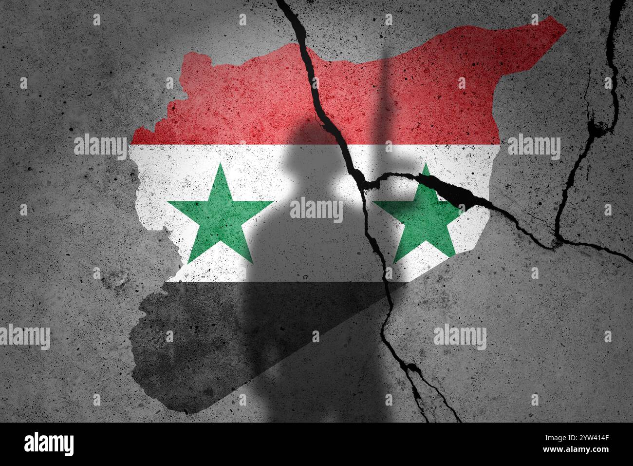 Flags of Syria painted on a cracked concrete wall with soldier shadow ...