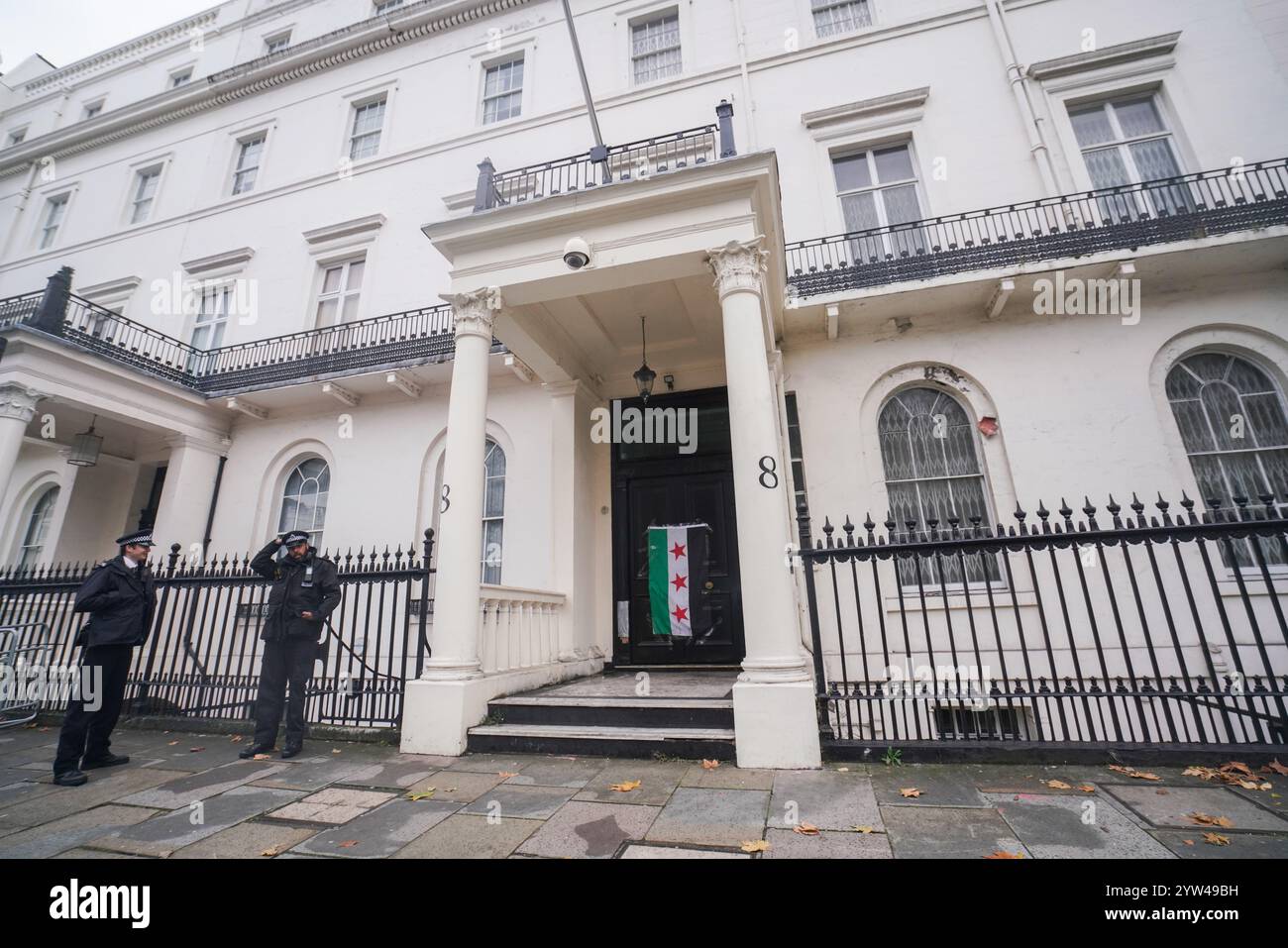 London, UK. 9 December 2024 A flag representing the Syrian opposition ...