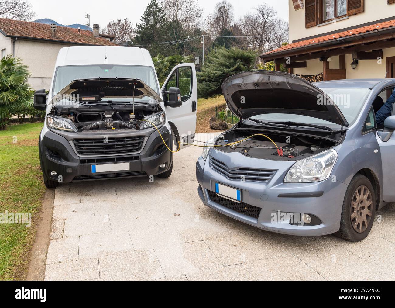 Resuscitating the car by jumpstarting its dead battery using another ...