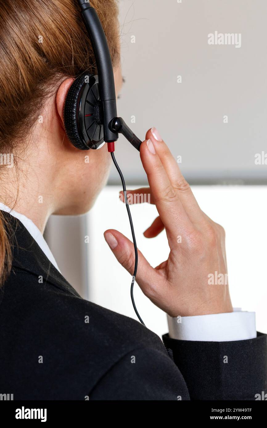 Woman headset rear view hi-res stock photography and images - Alamy