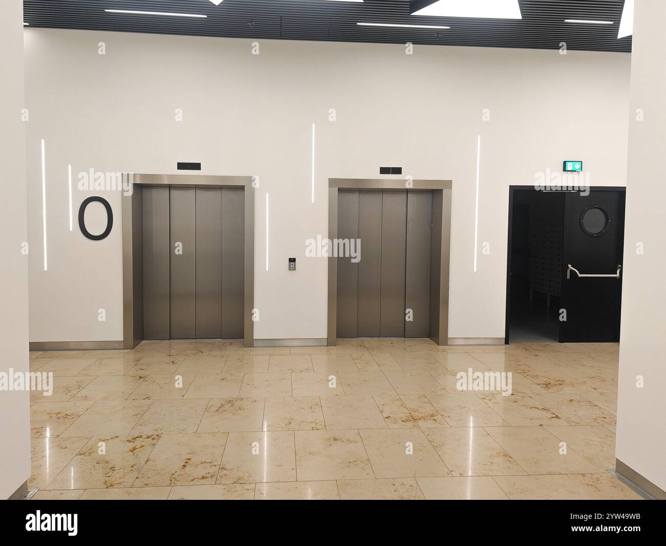 Emergency exit and elevator doors in shopping center of bus station ...