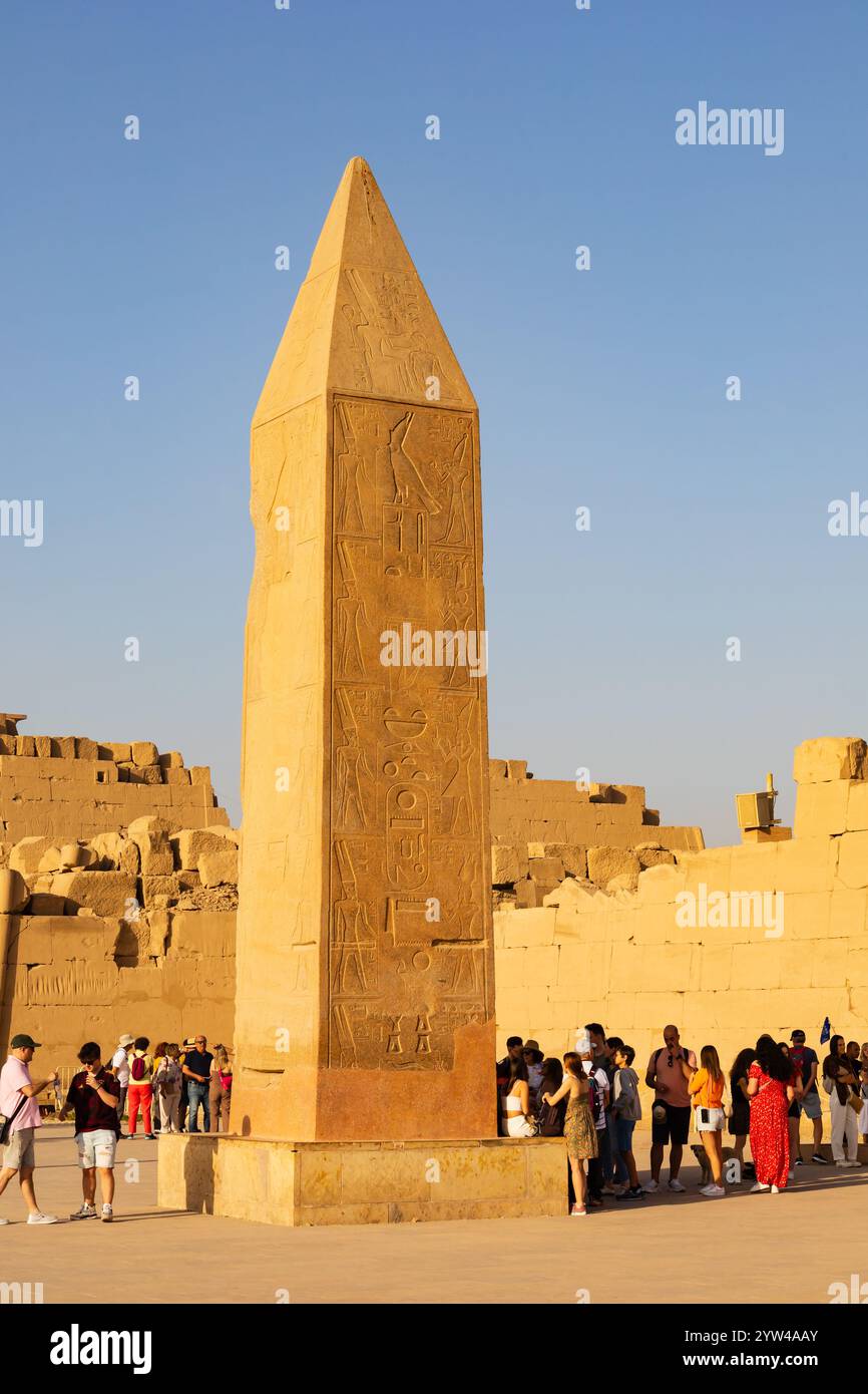 Tourists at the Obelisk of Thutmosis I, Ancient Egyptian open-air museum of Karnak Temple, El ...