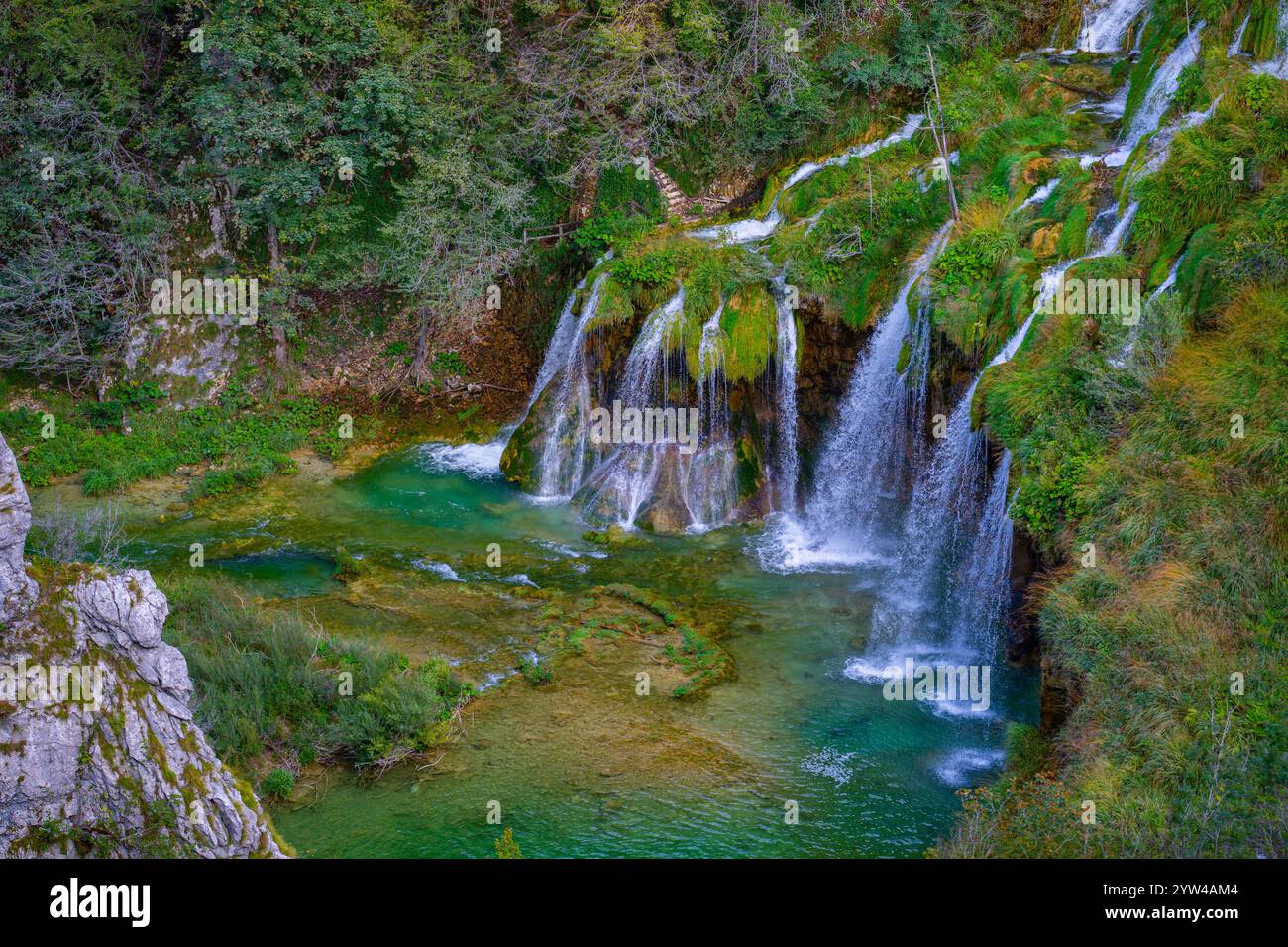 Waterfalls in the forest flowing into lakes. Tourists visit famous ...