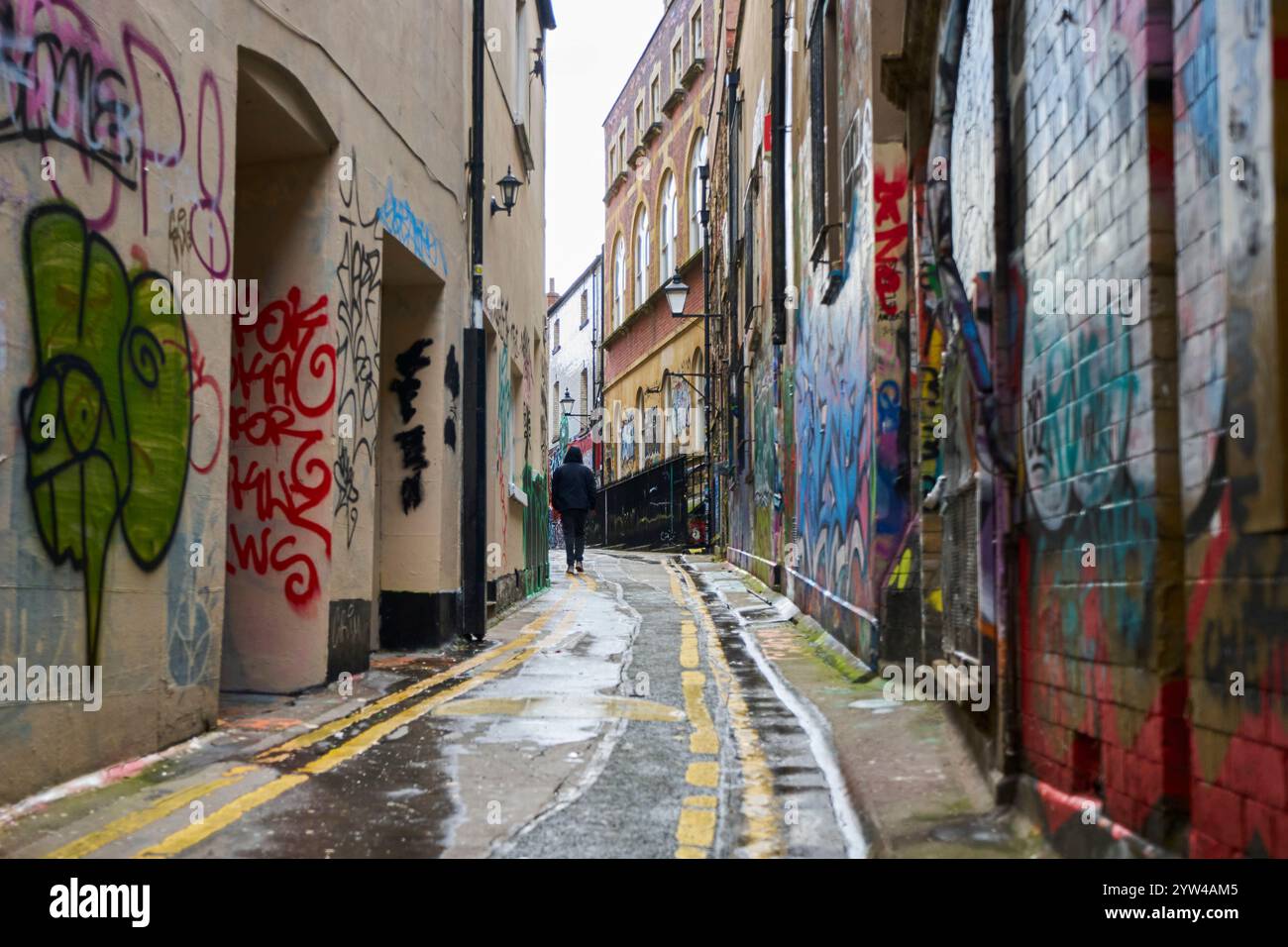 Graffiti Covered Buildings Painted By Street Artists On Small Street In ...