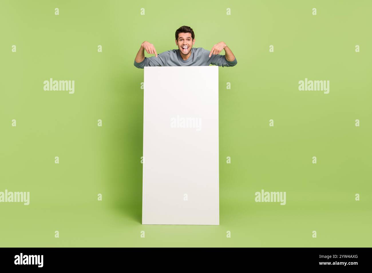 Full size photo of attractive guy promote recommend you long placard ...